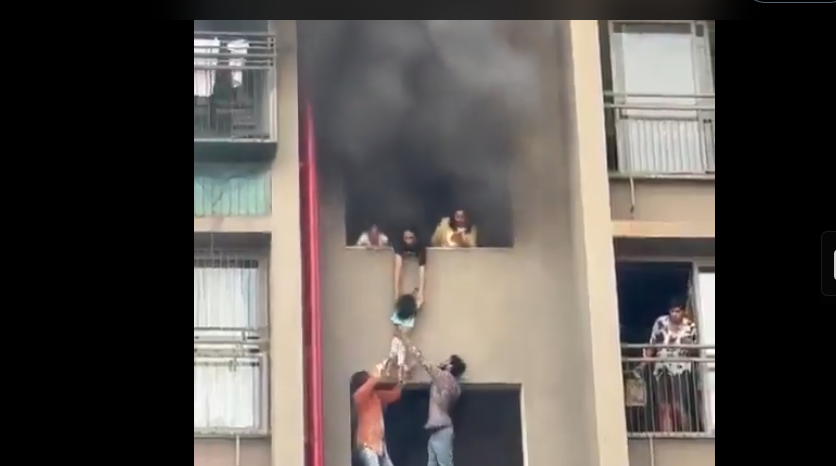 Woman dangles kids from fourth floor during fire mishap in Ahmedabad ...