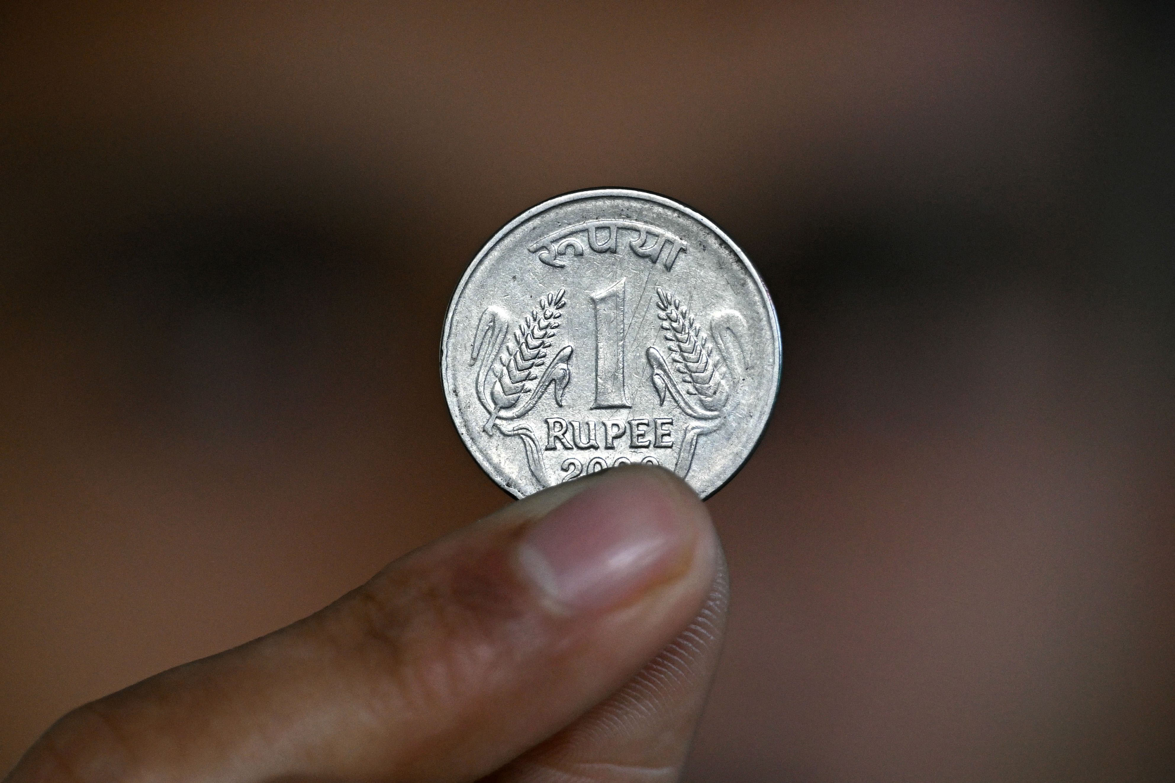 Rupee Hits Record Low of 90.52 Against Dollar